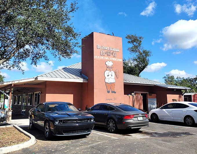The coral-colored building stands tall, like a monument to slow-cooked perfection in Tampa's barbecue landscape.
