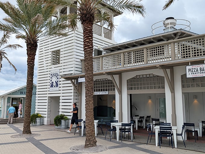 Coastal elegance! Bud & Alley's crisp white architecture and towering palms create a sophisticated seaside retreat that feels like the Hamptons went on vacation.