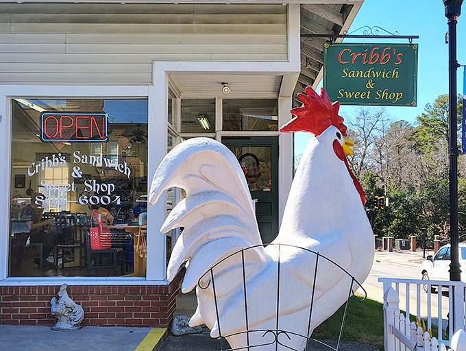 That rooster statue guards sandwich treasures like a delicious Southern sentinel.