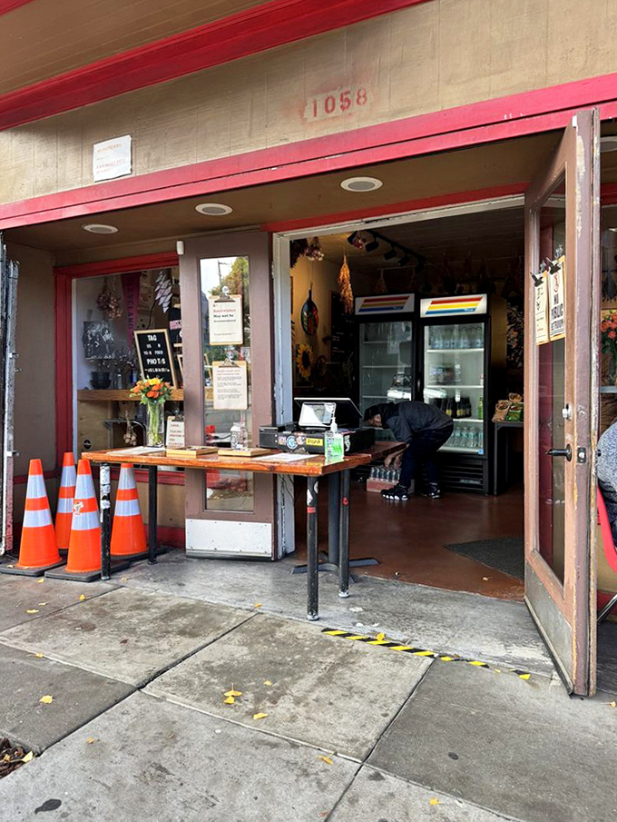 Those orange traffic cones suggest this tiny spot generates the kind of crowds worth managing.