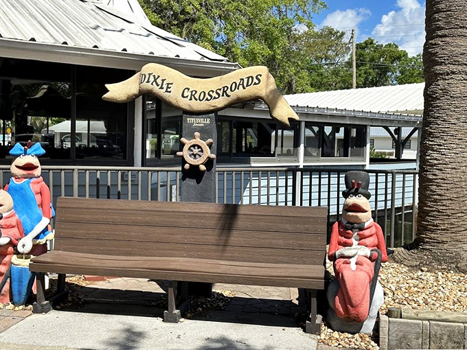 Dixie Crossroads' whimsical seafood mascots stand guard, promising rock shrimp treasures within this Titusville institution.