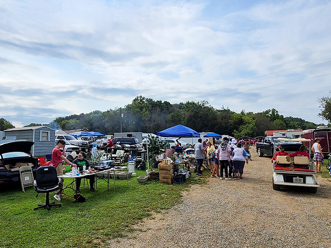 Blue tents dot the grassy field like a colorful village where neighbors gather to trade treasures.
