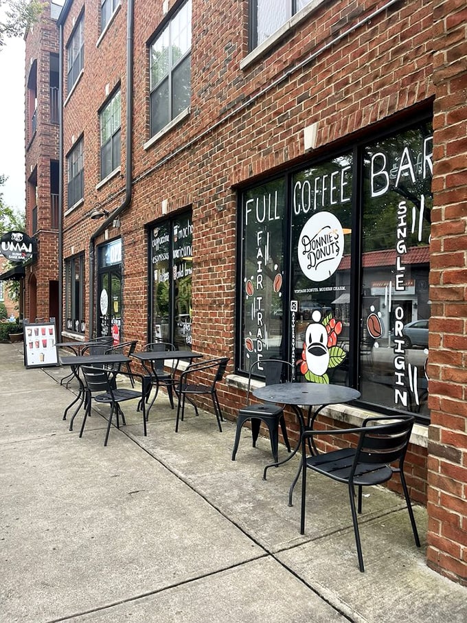 Donnie's Donuts' brick storefront with sidewalk seating - where coffee meets artisan donuts in a match made in breakfast heaven.