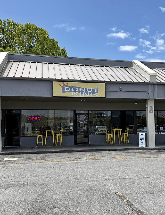 Hidden royalty in a strip mall! Those bright yellow stools are thrones for donut enthusiasts.