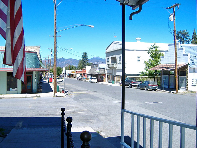 Etna's brick buildings stand sentinel in Scott Valley, guardians of small-town secrets and mountain morning coffee rituals.
