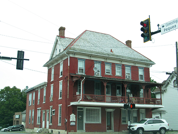 That red brick building has witnessed decades of small-town life, standing strong through changing times.