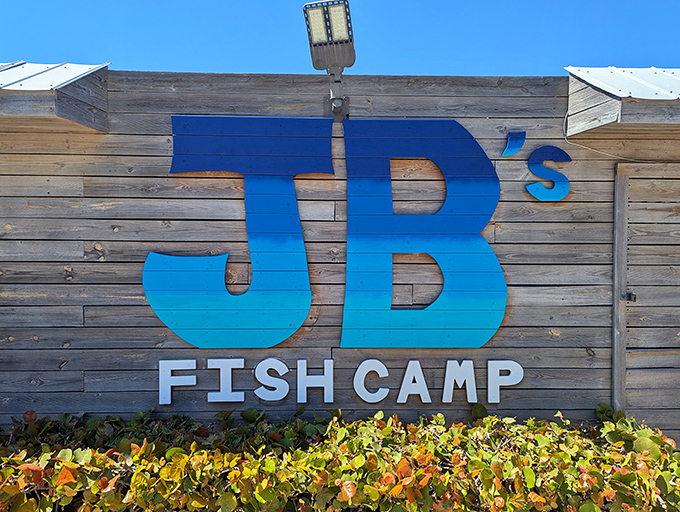 JB's blue sign against the sky is like a promise - beyond this entrance lies seafood worth writing home about.