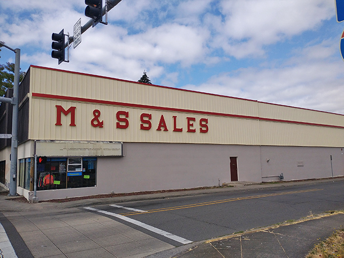 M&S Sales stretches along the street like a western outpost, promising cowboy treasures behind its red-trimmed facade.