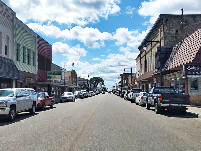 Manistique's main street flows like the river it's named for, carrying dreams of affordable living to every doorstep.