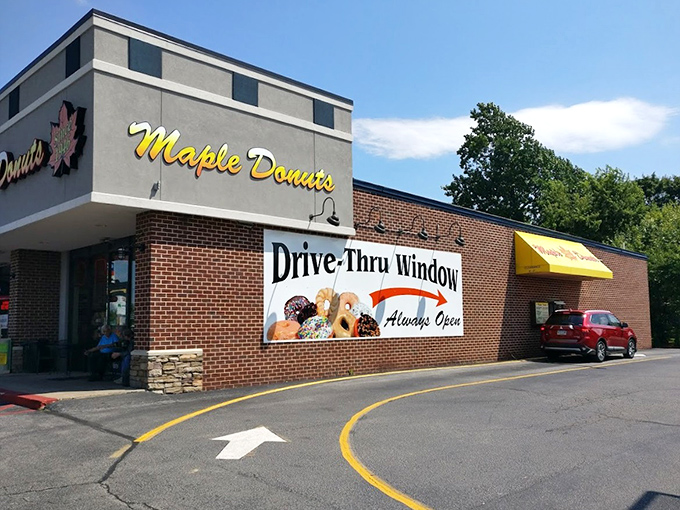 The drive-through window says convenience, but the brick building promises old-school donut quality.