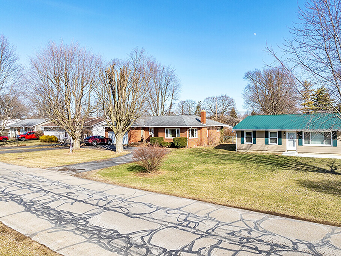 Marion's colorful houses line up like a cheerful greeting card, proving home doesn't need expensive decorating.