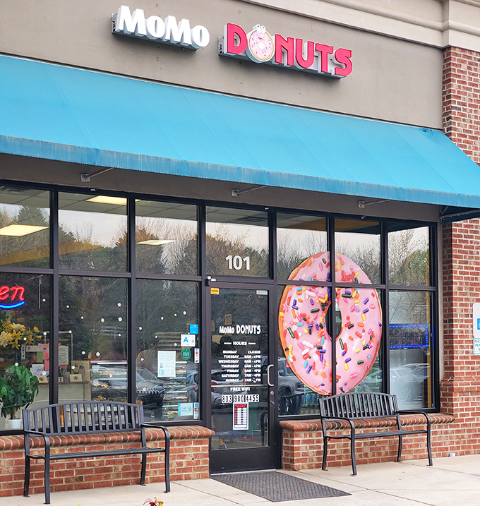 Pretty in pink! MoMo's giant donut door art is like a portal to a sweeter dimension of sprinkles and glazes.