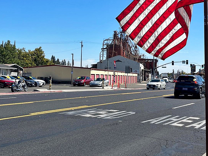 Small town pride waves high where historic industrial structures stand as monuments to California's hardworking agricultural heritage.