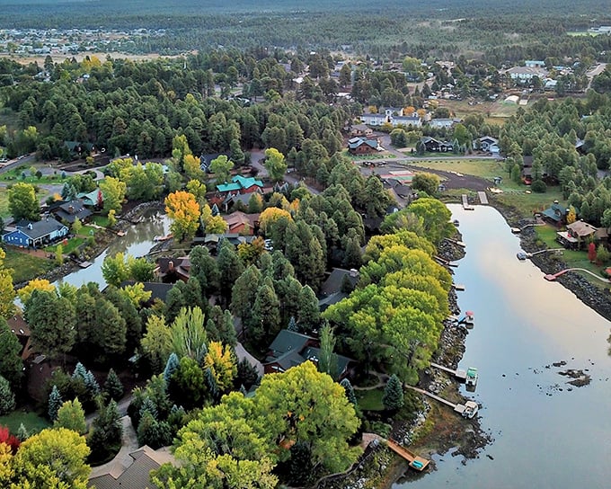Pinetop-Lakeside's lake reflects surrounding trees like nature's own mirror in the high country.