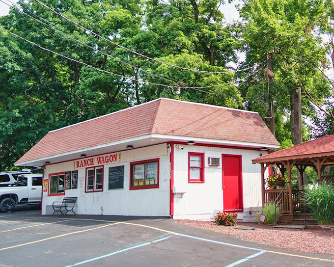 White clapboard with red trim&mdash;a hot dog cottage in a parking lot. This roadside gem proves good things come in small, unassuming packages.