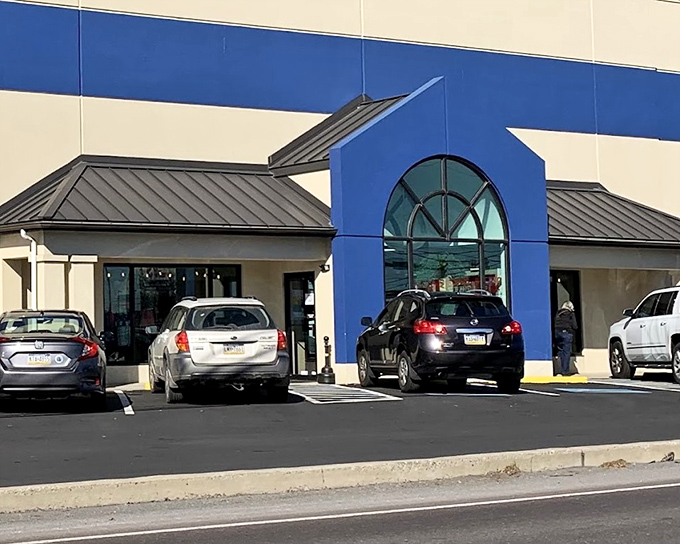Re-Uzit Shop's distinctive blue and cream facade stands out in New Holland. A thrifter's paradise with small-town charm.