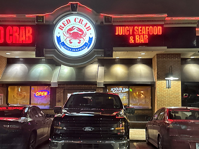 Red Crab's neon glow cuts through the night like a lighthouse for the hungry. Those cars aren't just parked&mdash;they're waiting for seafood magic.