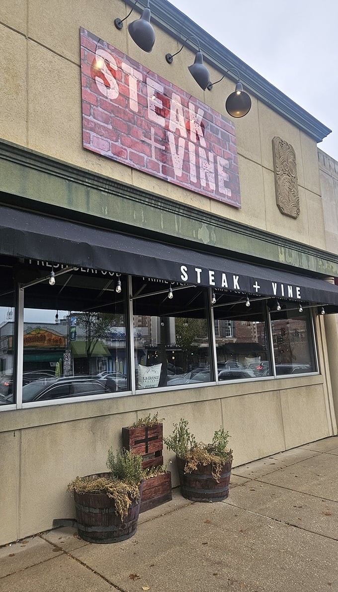 Rustic barrel planters and downtown charm - where small-town sophistication meets serious steak craftsmanship perfectly. 