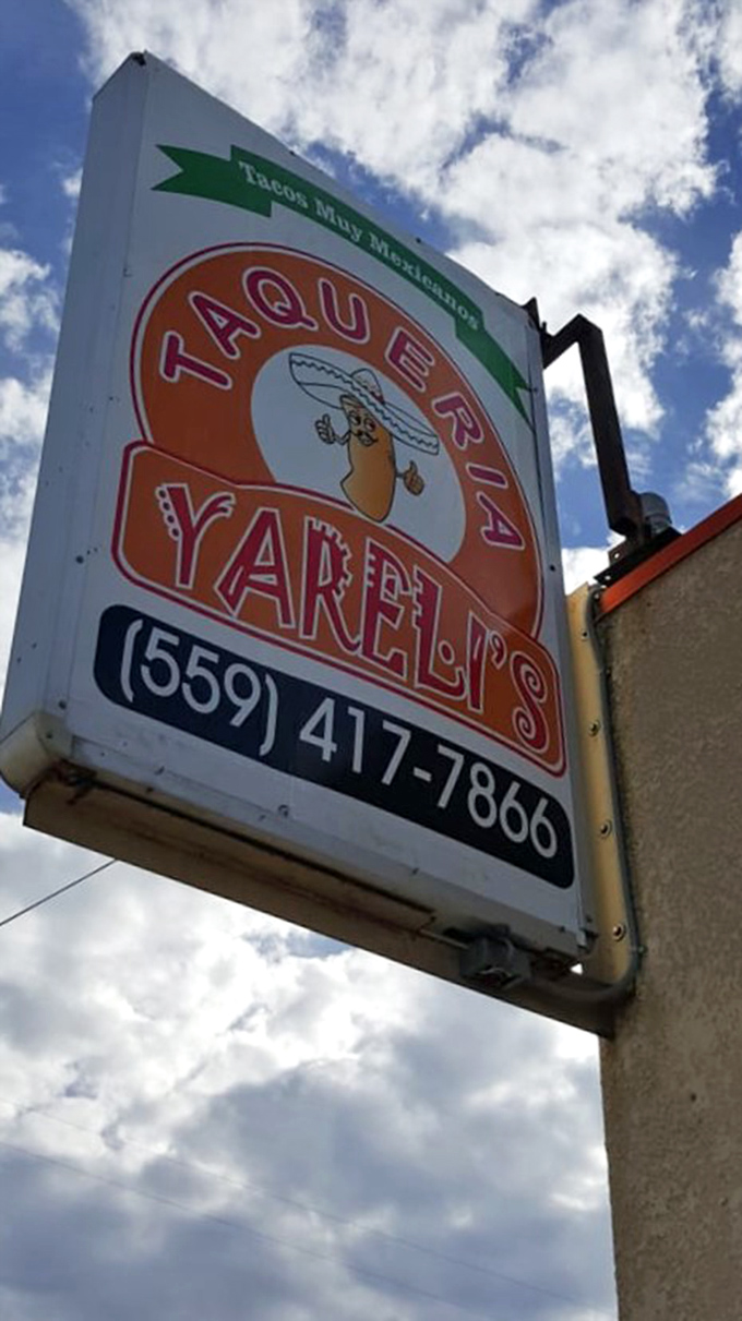 That classic taco stand sign promises "muy sabroso" flavors - and brother, they deliver on every single delicious word.