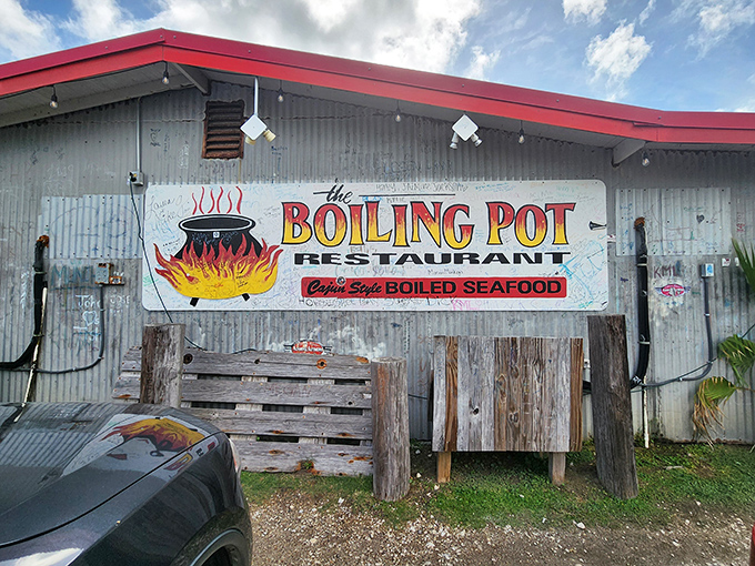 The Boiling Pot's corrugated metal charm screams "authentic seafood joint." No frills, just thrills for your taste buds!