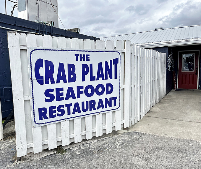 The Crab Plant's simple white fence and bold blue sign make a promise: incredible seafood without pretense. They deliver.
