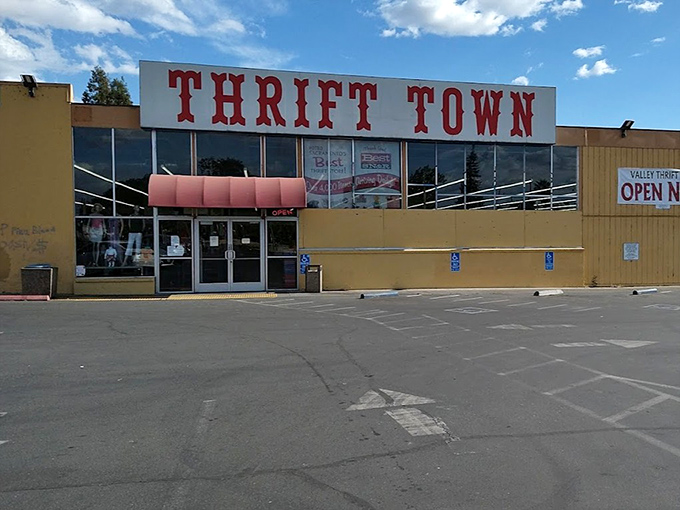 Thrift Town's retro sign beckons like a neon promise of polyester paradise and vintage victories.
