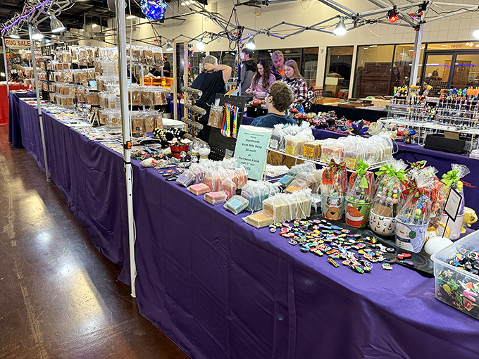 Purple table displays showcase crafts and treasures with the care of a fine art gallery.
