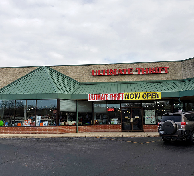 Ultimate Thrift's green roof and "NOW OPEN" sign practically shout "Come find amazing deals!"
