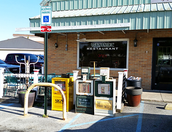 Brick buildings with newspaper boxes outside&mdash;where locals catch up on town gossip over morning coffee.
