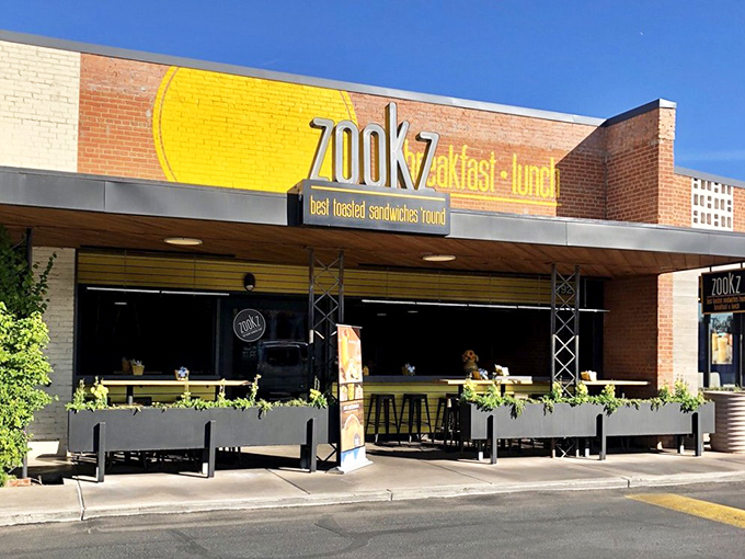 Bright yellow signage and modern brick create an inviting spot for those famous round sandwiches.