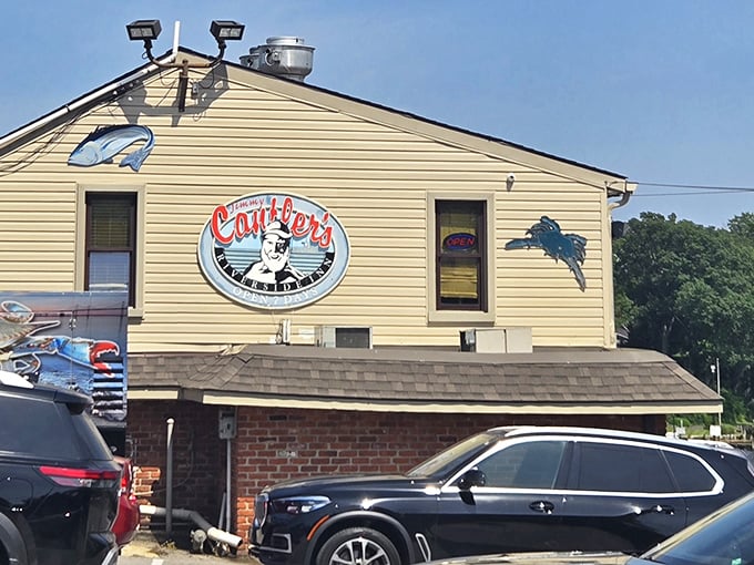 Yellow siding and nautical charm signal that authentic Chesapeake Bay experience awaits within.