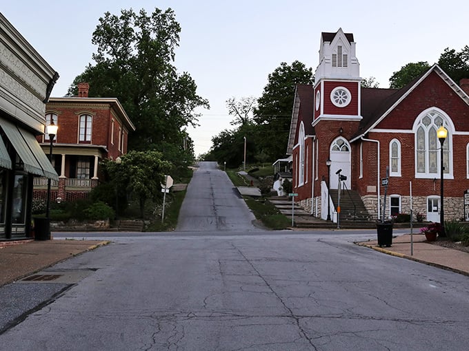 This hillside church and vintage storefronts create a postcard scene that Instagram could never quite capture properly.