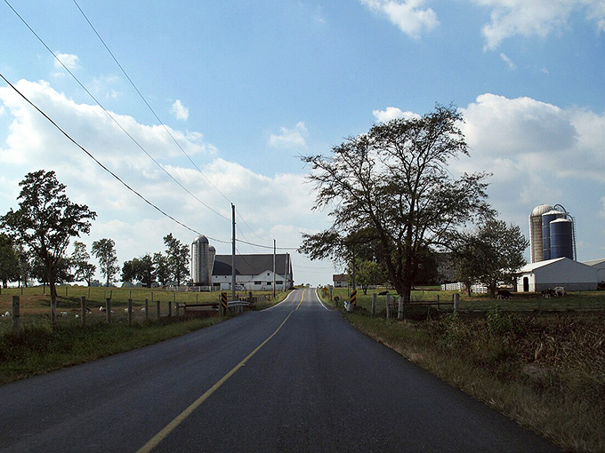 Country roads lead to working farms where silos stand sentinel over Pennsylvania's fertile agricultural heartland.