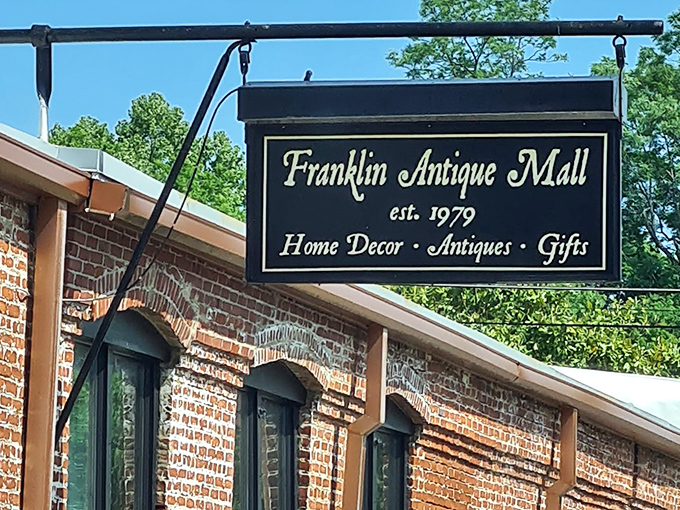 That elegant sign against blue Tennessee sky promises a day of discoveries. Your wallet might be lighter, but your heart will be full.