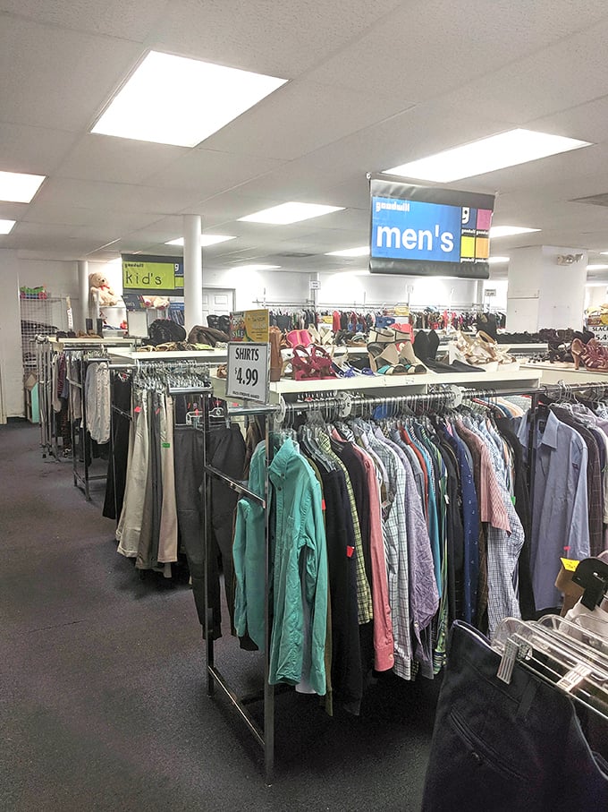 Rows of clothing stretch like a fabric rainbow, where every hanger holds potential for wardrobe magic at unbeatable prices.