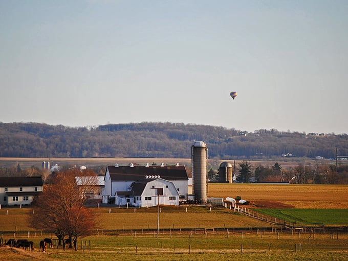 Hot air balloons drift overhead like colorful dreams, adding magic to an already perfect landscape.