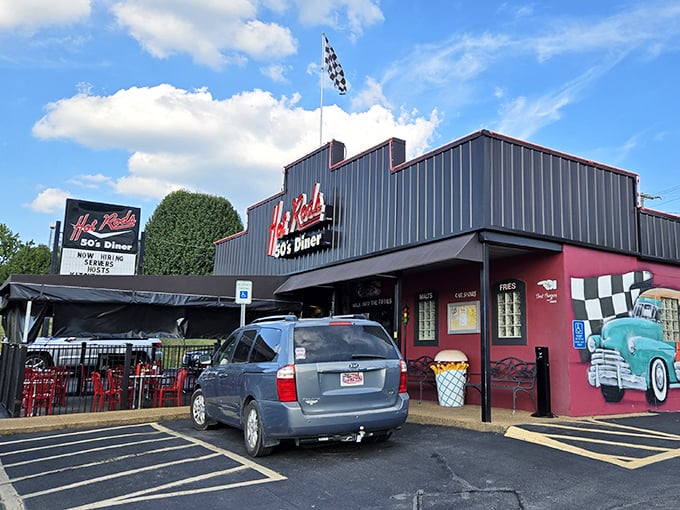 Checkered flags and cherry-red walls announce "this isn't just a meal, it's an experience!" Even the building looks deliciously retro.
