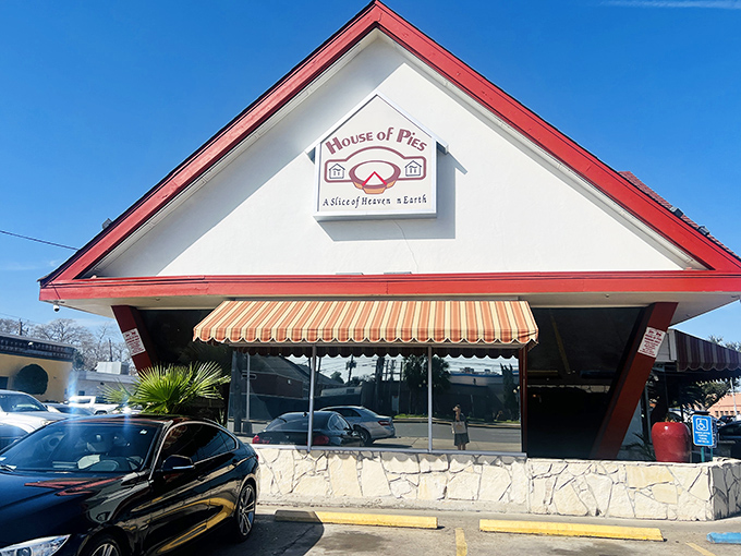 The distinctive red-trimmed roof of House of Pies has sheltered generations of dessert enthusiasts.