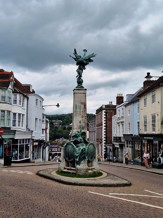 A striking statue stands at the center of Lewes' historic town square, surrounded by charming buildings that offer affordable living options.