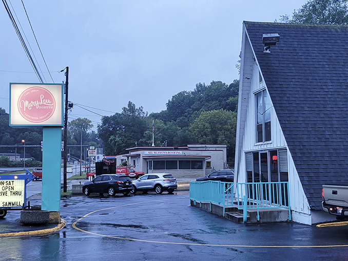 Even in the rain, Mary Lou's teal-trimmed A-frame stands out like a cheerful umbrella in a sea of gray.