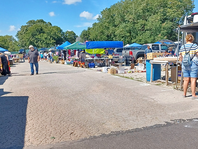 Neat displays under protective tents create comfortable browsing conditions for serious bargain hunting expeditions.
