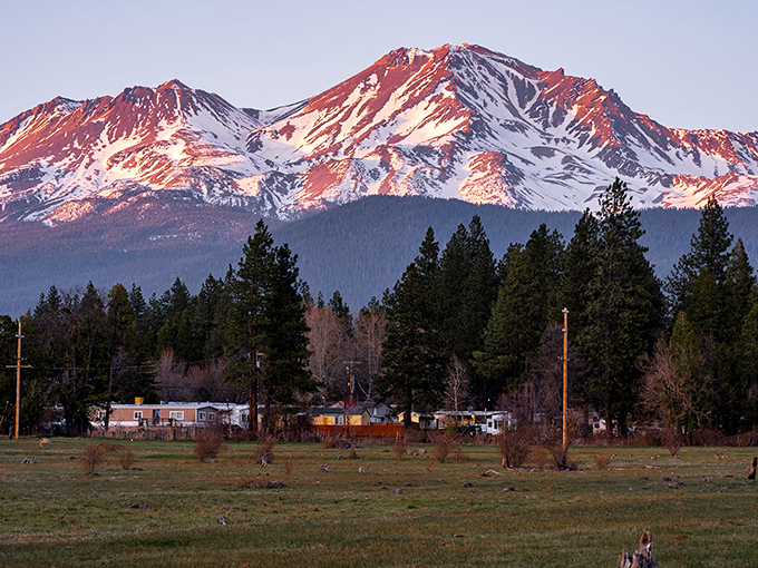 As the sun sets on Mount Shasta, the warm light on the snow makes the whole mountain glow with peaceful power.