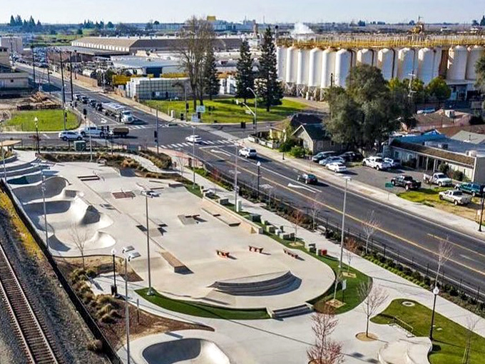 Modern skate parks bring youthful energy to established communities where old grain silos watch over new generations at play.
