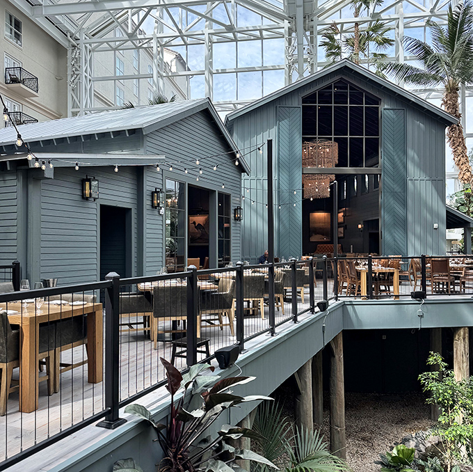 The blue-gray barn aesthetic isn't just for show&mdash;it's architectural foreshadowing for the rustic flavors waiting inside Old Hickory's elegant interior.
