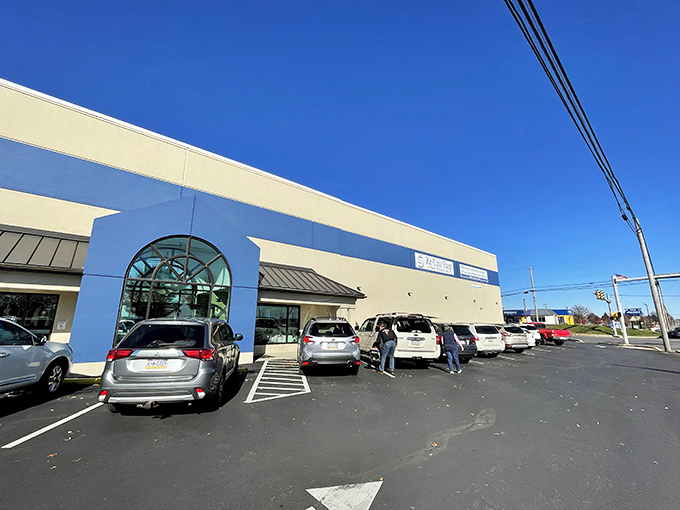 Cars line up outside Re-Uzit Shop like eager treasure seekers at the starting line of a particularly stylish scavenger hunt.