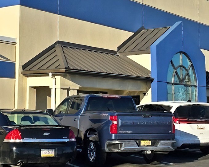 Parking spots filled at Re-Uzit Shop—always a good sign you've found a local treasure trove worth exploring.