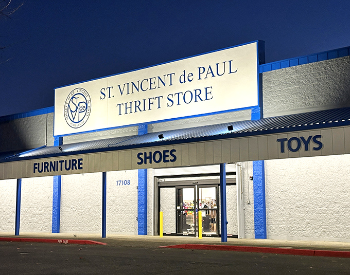 The bright blue awning beckons like a friendly neighbor inviting you over for coffee and the best garage sale ever.