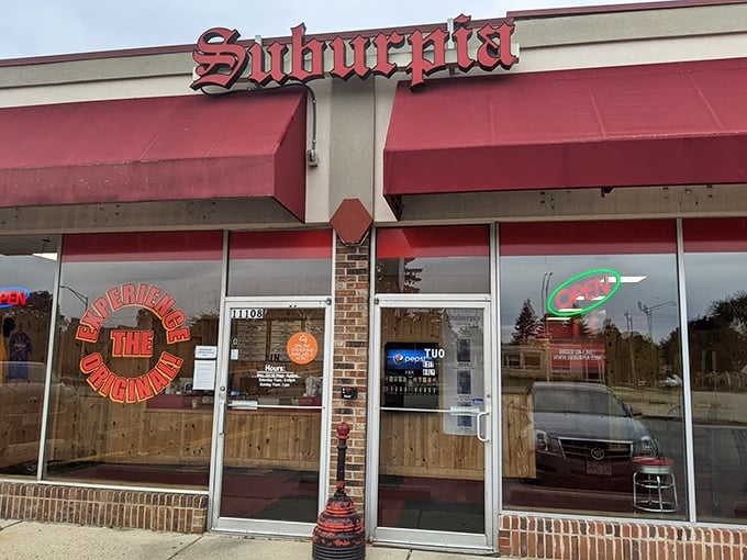Red awnings and brick accents create that perfect deli atmosphere where great sandwiches are born.