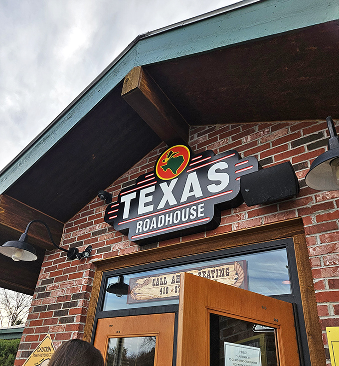 The familiar brick-and-wood entrance of Texas Roadhouse welcomes guests with the promise of hearty steaks and comfort.