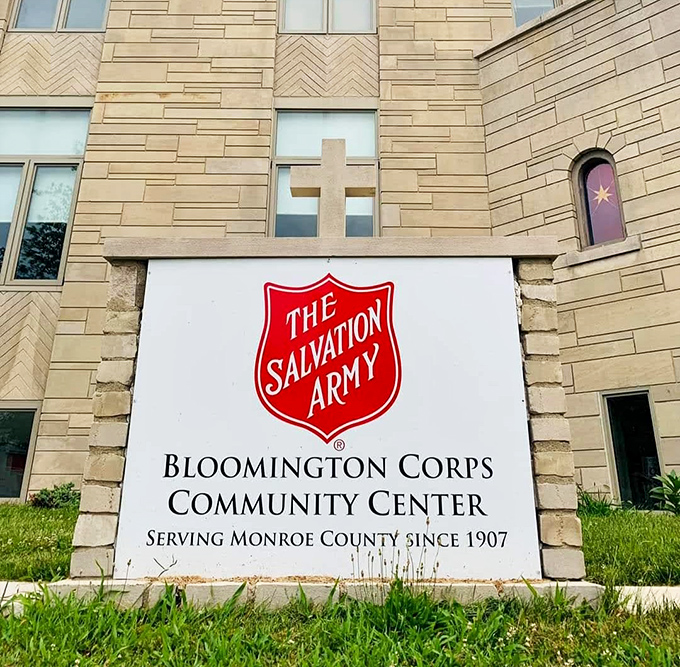 That distinctive red shield represents more than thrift shopping - it's community support disguised as retail.